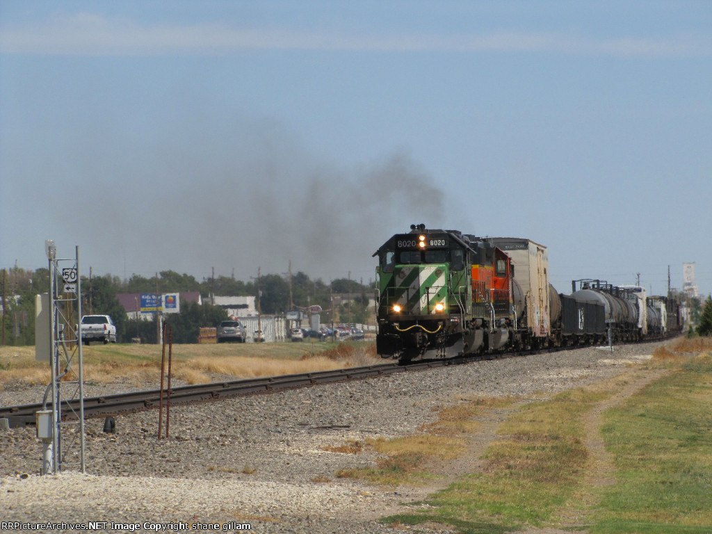 BNSF 8020 rolls west out of dodge city.